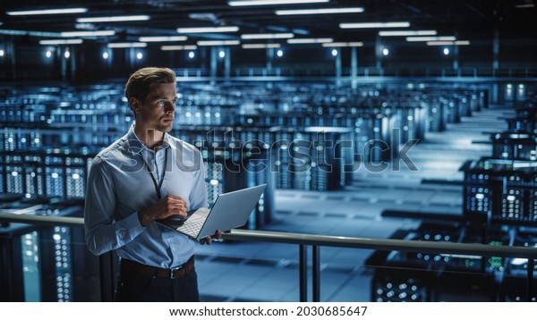 Data Center Specialist Engineer Using Laptop Stock Photo 2030685647 ...