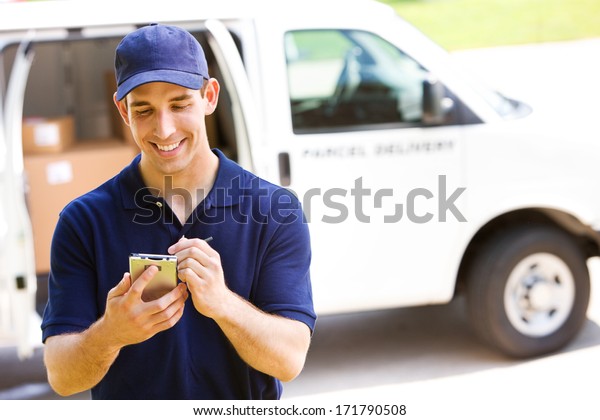 Delivery Man Checking Portable Delivery Device Stock Photo (Edit Now ...