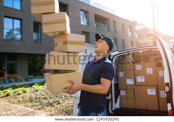 Delivery Man Dropping Boxes Stock Photo 1245920245 | Shutterstock