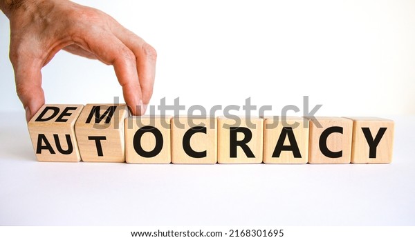 Democracy Autocracy Symbol Businessman Turns Wooden Stock Photo ... Democracy Autocracy Symbol Businessman Turns Wooden Stock Photo ...