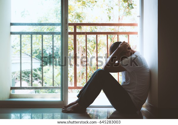 Depressed Man Sitting Dark Roomdramatic Concept Stock Photo 645283003 ...