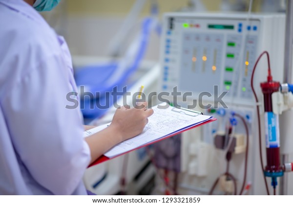 Dialysis nurse are checking dialysis machine before hemodialysis ...