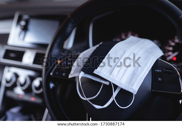 different protective medical mask that is placed on the steering wheel ...