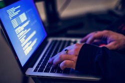 Diverse computer hacking featuring action, closeup, and coding, a ...