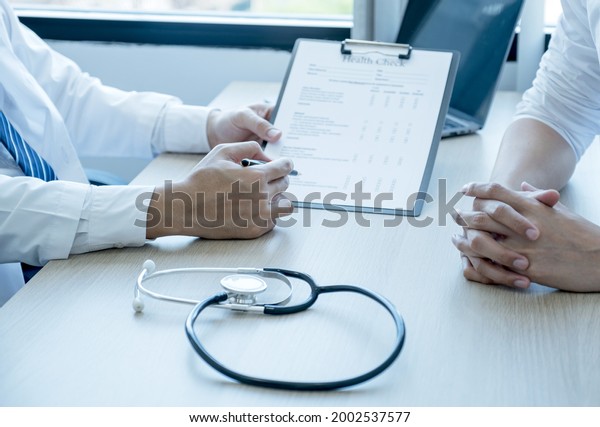 Doctor Hand Write Report Explained Examination Stock Photo 2002537577 ...