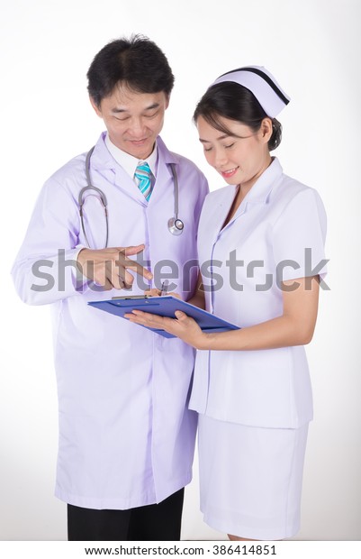 Doctor Nurse Reviewing Medical Chart Isolated Stock Photo 386414851 ... Doctor Nurse Reviewing Medical Chart Isolated Stock Photo 386414851 ...