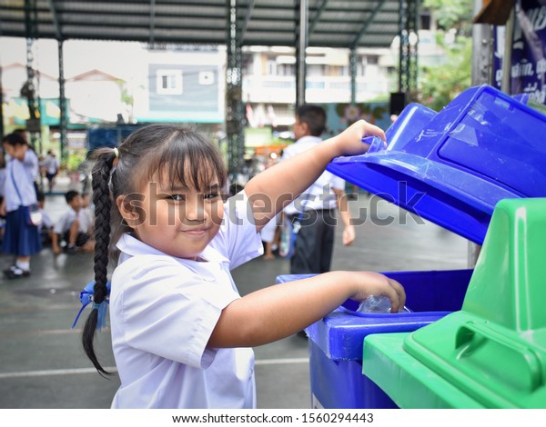 Elementary School Students Throwing Garbage Into Stock Photo 1560294443 ...