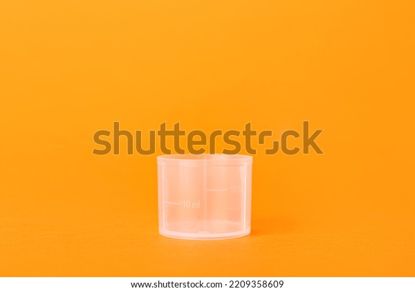 Empty Measuring Cup On Orange Background Stock Photo 2209358609 ...
