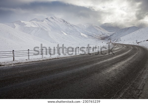 Empty Mountain Road On Cloudy Winter Stock Photo (Edit Now) 230765239