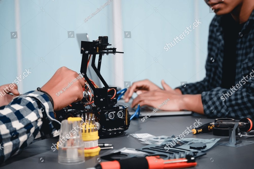 Engineer Asian Students Assembling Robotics Kits. Learning Mechanical Control, Robotics combines ...