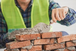 Handy man working in the house featuring building, plastering, and ...