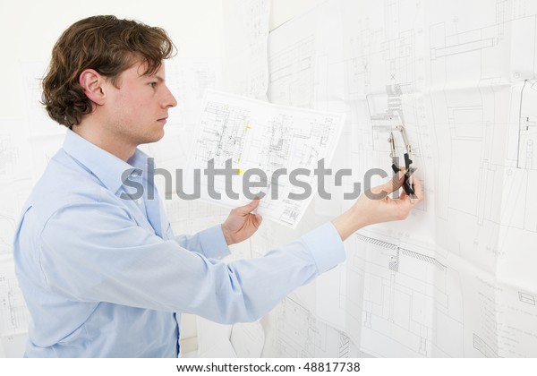 Engineer Cross Referencing Technical Drawings Pair Stock Photo 48817738 ...