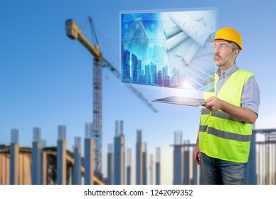 Engineer Holding Tablet Displaying Construction Plans Stock Photo ...