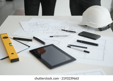 Engineers Helping Design Work On Blueprints Stock Photo 2193239663 ...
