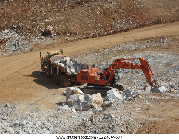 Excavator Loading Rock Materials Into Dump Stock Photo 1223649697 ...