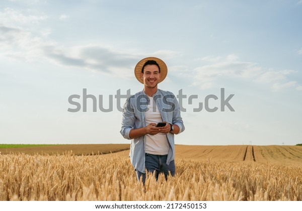 Farmer Using Mobile Phone While Standing Stock Photo 2172450153 ...