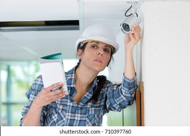 Female Cctv Installer Checking Security Camera Stock Photo 710397760 ...