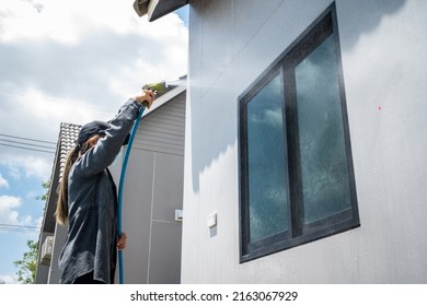 Female Engineer Using Hose Testing Window Stock Photo 2163067929 ...