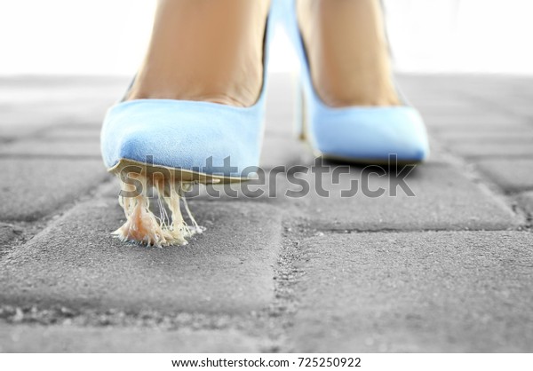 Female Foot Stuck Into Chewing Gum On Street Concept Of Stickiness