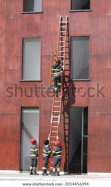 Fire Brigade Team Performing Exercise Using Stock Photo 2014456394 ...