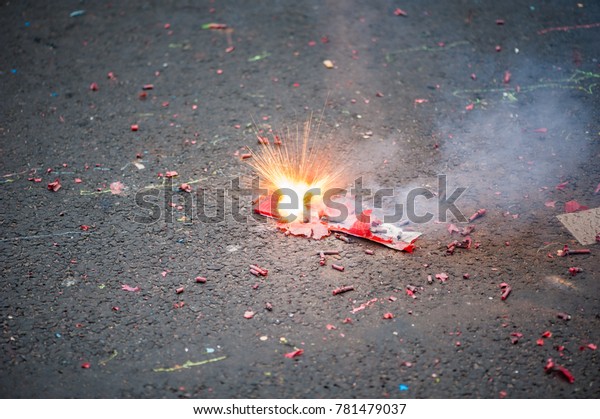 Firecracker exploding in the street for the chinese new year celebration
