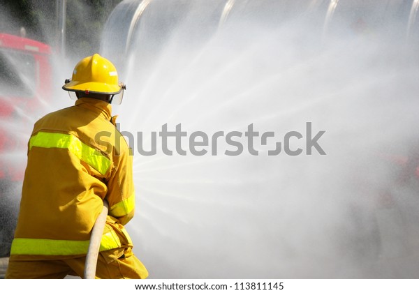 Firefighter fighting For A Fire Attack, During A Training Exercise