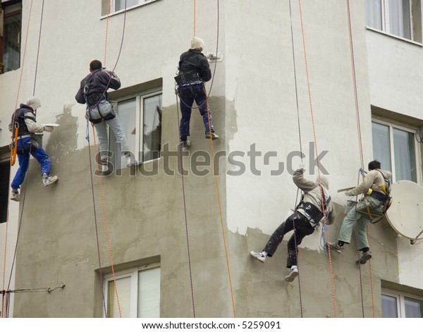 Five Construction Workers Hanging On Rope Stock Photo 5259091 ...