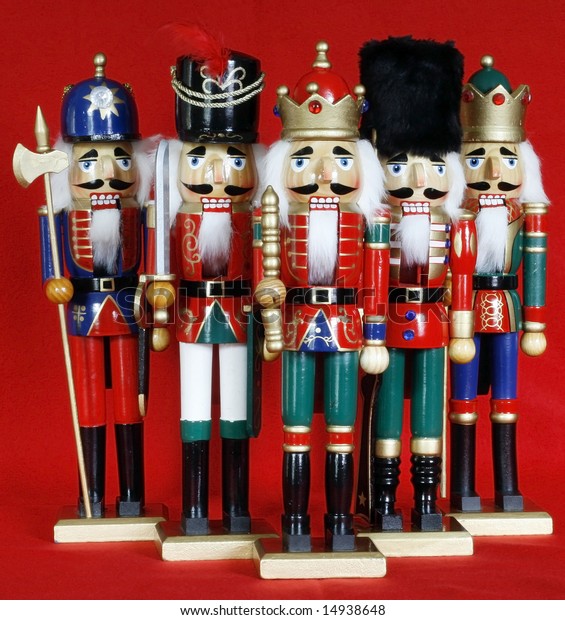 Five Holiday Nutcrackers Red Background Stock Photo 14938648 | Shutterstock