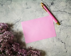 Flatlay arrangement with writing pad, a Photo by Yolo Berlin