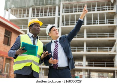 Foreman Showing Builder Something Construction Site Stock Photo ...