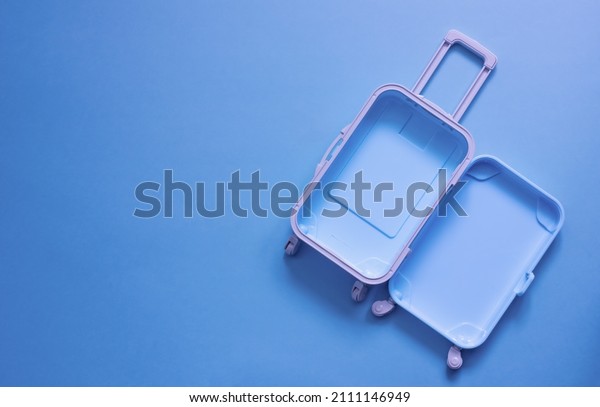 Стоковая фотография 2111146949: Fully Opened Blue Suitcase On Blue ...