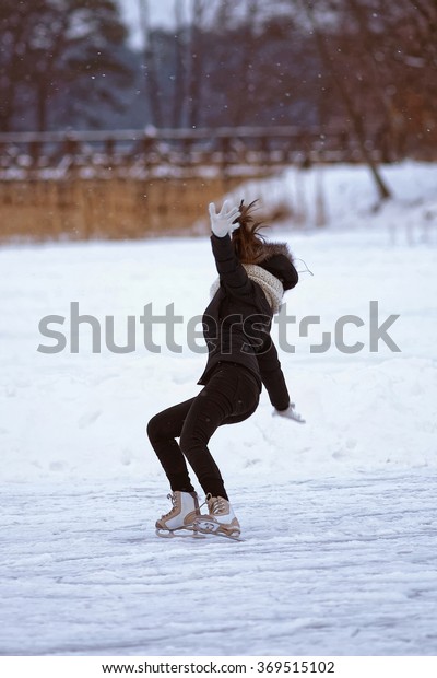 Girl Falling Down While Ice Skating Stock Photo (Edit Now) 369515102