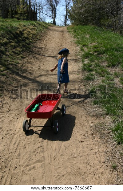 Girl Pulling Wagon Stock Photo (Edit Now) 7366687