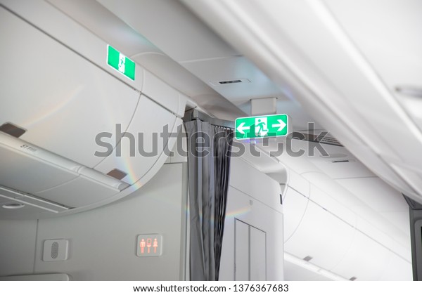 Green Emergency Exit Sign Commercial Aircraft Stock Photo (Edit Now ... Green Emergency Exit Sign Commercial Aircraft Stock Photo (Edit Now ...