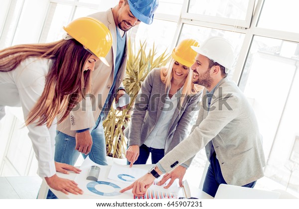 Group Architects Correcting Construction Plan Office Stock Photo ...