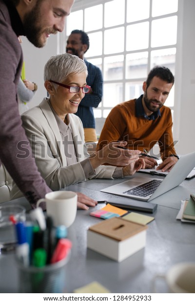 Group of business people working together in the modern office space. Group of business people working together in the modern office space.