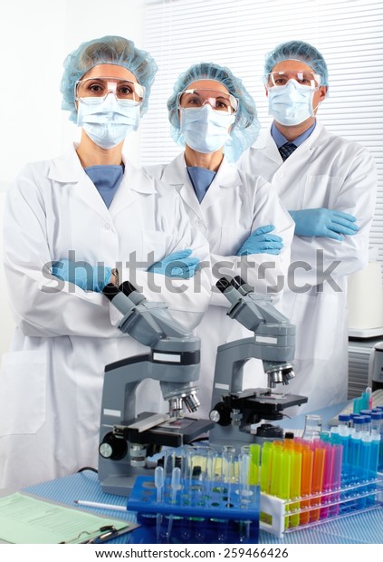 Group of medical doctors in laboratory. Scientific research. Group of medical doctors in laboratory. Scientific research.