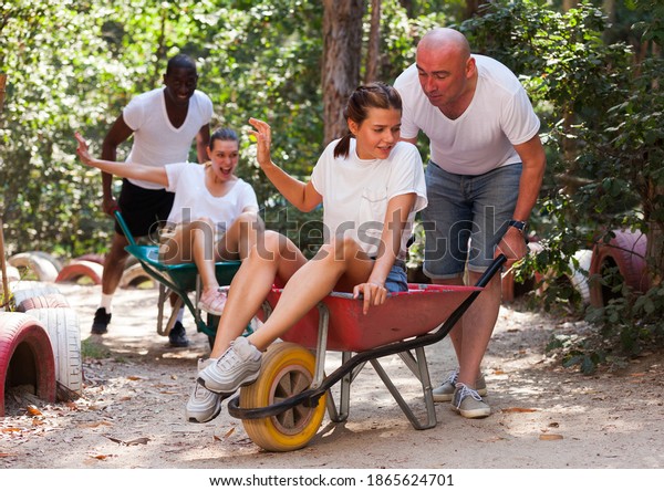 Group People Doing Exercise Wheelbarrows Together Stock Photo ...