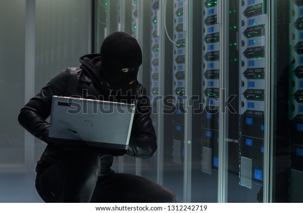 Hacker Black Mask Using Computer Breaking Stock Photo 1312242719 ...