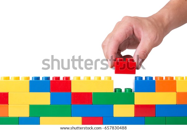 Hand Building Wall By Stacking Block Stock Photo (Edit Now) 657830488