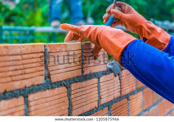 Hand Construction Worker Laying Down Brick Stock Photo 1205875966 ...