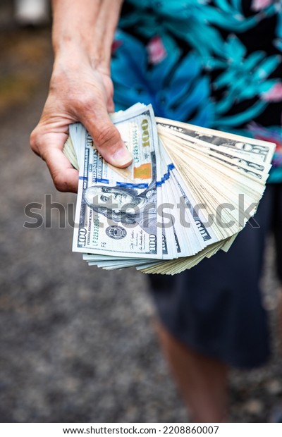 Hand Extending Holding Stack Currency Usd Stock Photo 2208860007 ...