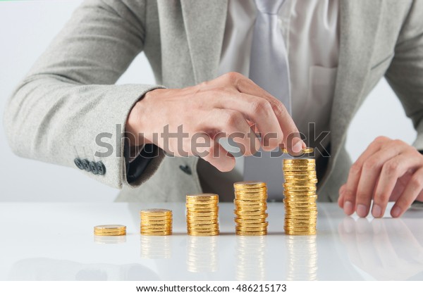 Hand Putting Stack Coins Stock Photo 486215173 | Shutterstock