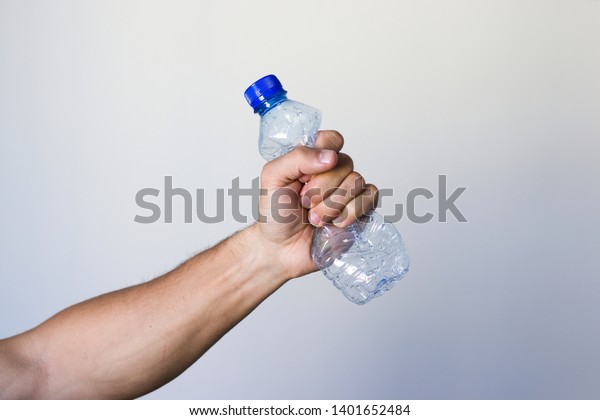 Hand Squeezing Plastic Bottle Representing Movement Stock Photo ...