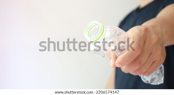 Hand Squeezing Plastic Bottle Representing Movement Stock Photo ...