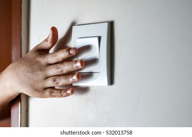 Child Hand Turning On Light Wall Stock Photo (Edit Now) 560073796