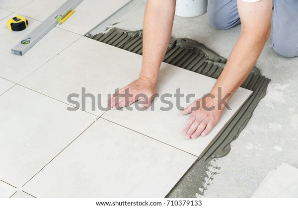 Hands Worker Pressing Ceramic Tile Floor Stock Photo 710379133 ...