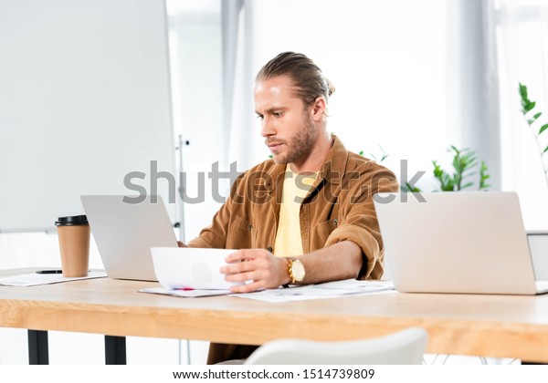 Handsome Man Doing Paperwork Looking Laptop Stock Photo 1514739809 ...