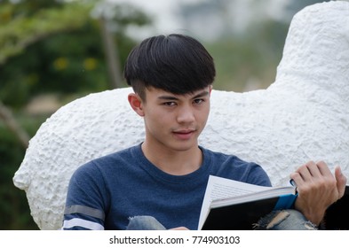 Handsome Young Guy Thinking While Reading Stock Photo 774903103 ...