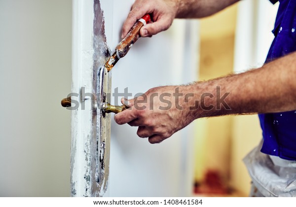 Handyman Using Chisel Around Doors Lock Stock Photo 1408461584 ...